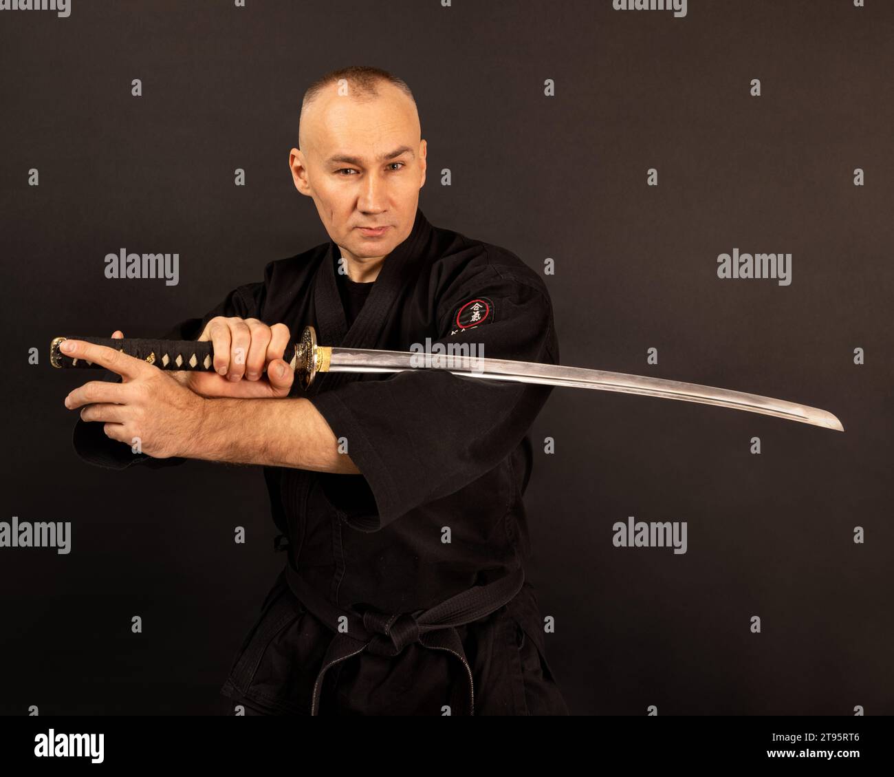Portrait of aikido sensei master with black sensei belt in taekwondo ...