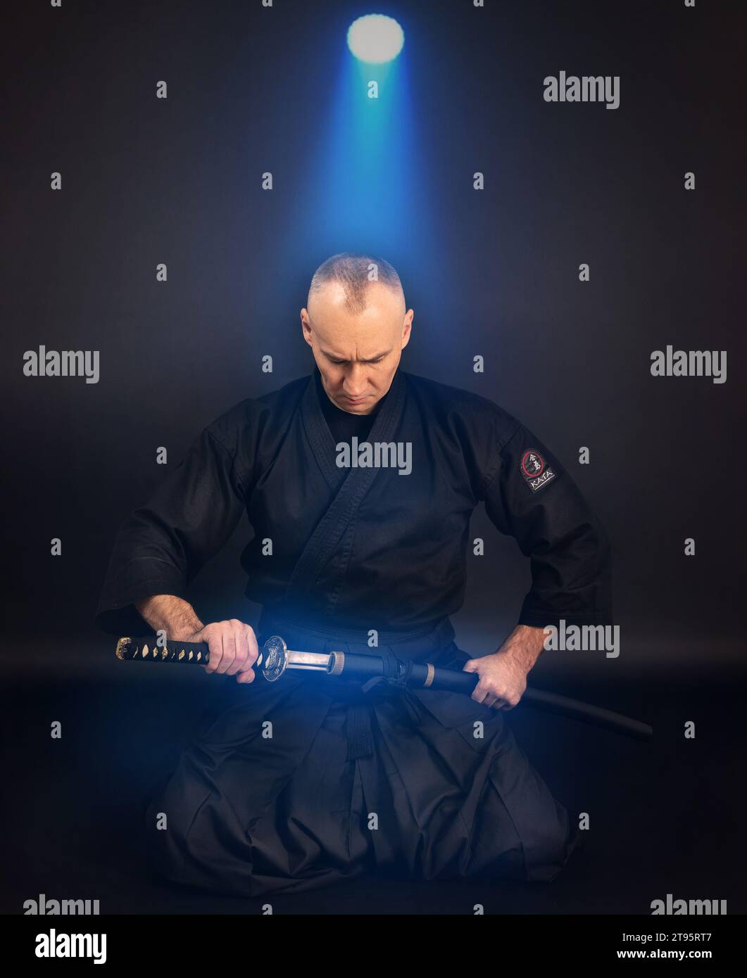 Portrait of aikido sensei master with black sensei belt in taekwondo ...