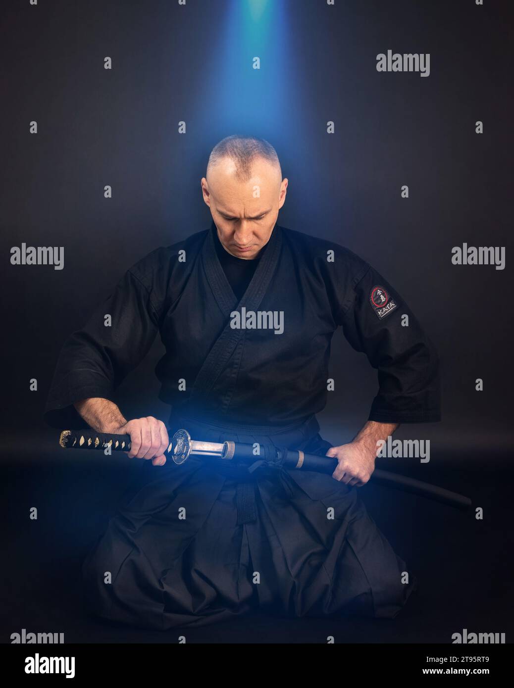 Portrait of aikido sensei master with black sensei belt in taekwondo ...