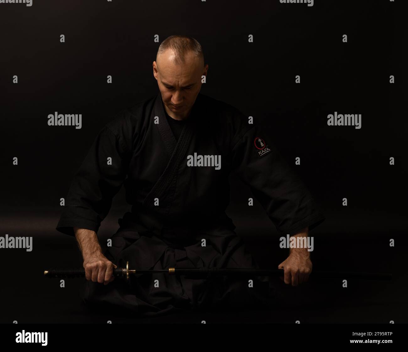 Portrait of aikido sensei master with black sensei belt in taekwondo ...