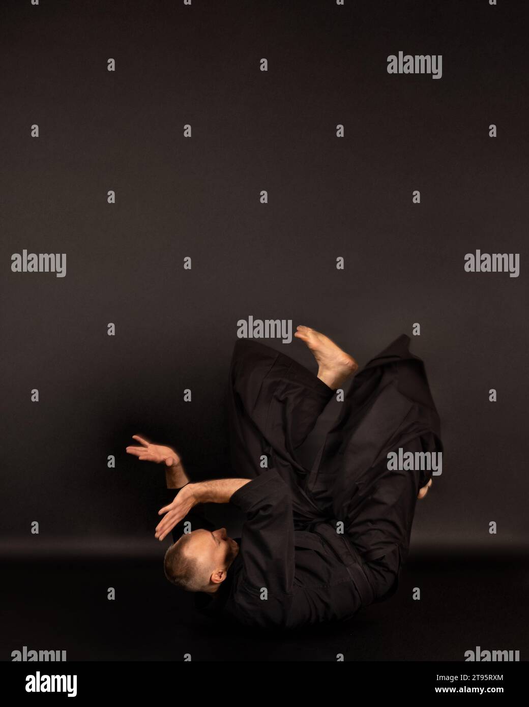 Portrait of aikido sensei master with black sensei belt in taekwondo ...