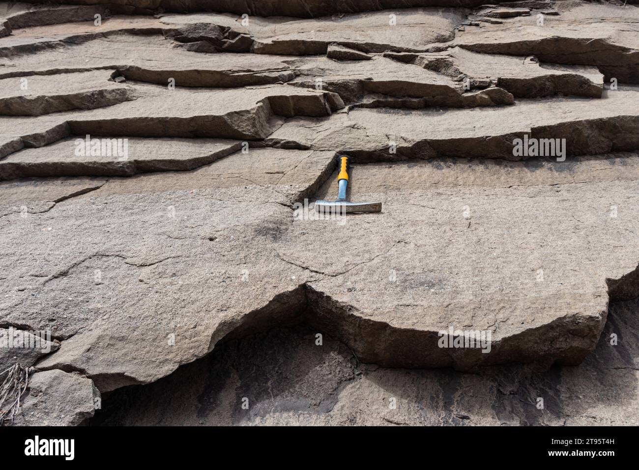 Hammer used as a reference on sedimentary rocks Stock Photo - Alamy