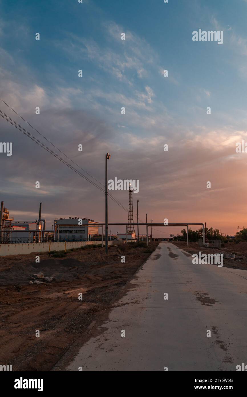 Oil and gas resource processing plant under sunset in the evening Stock ...