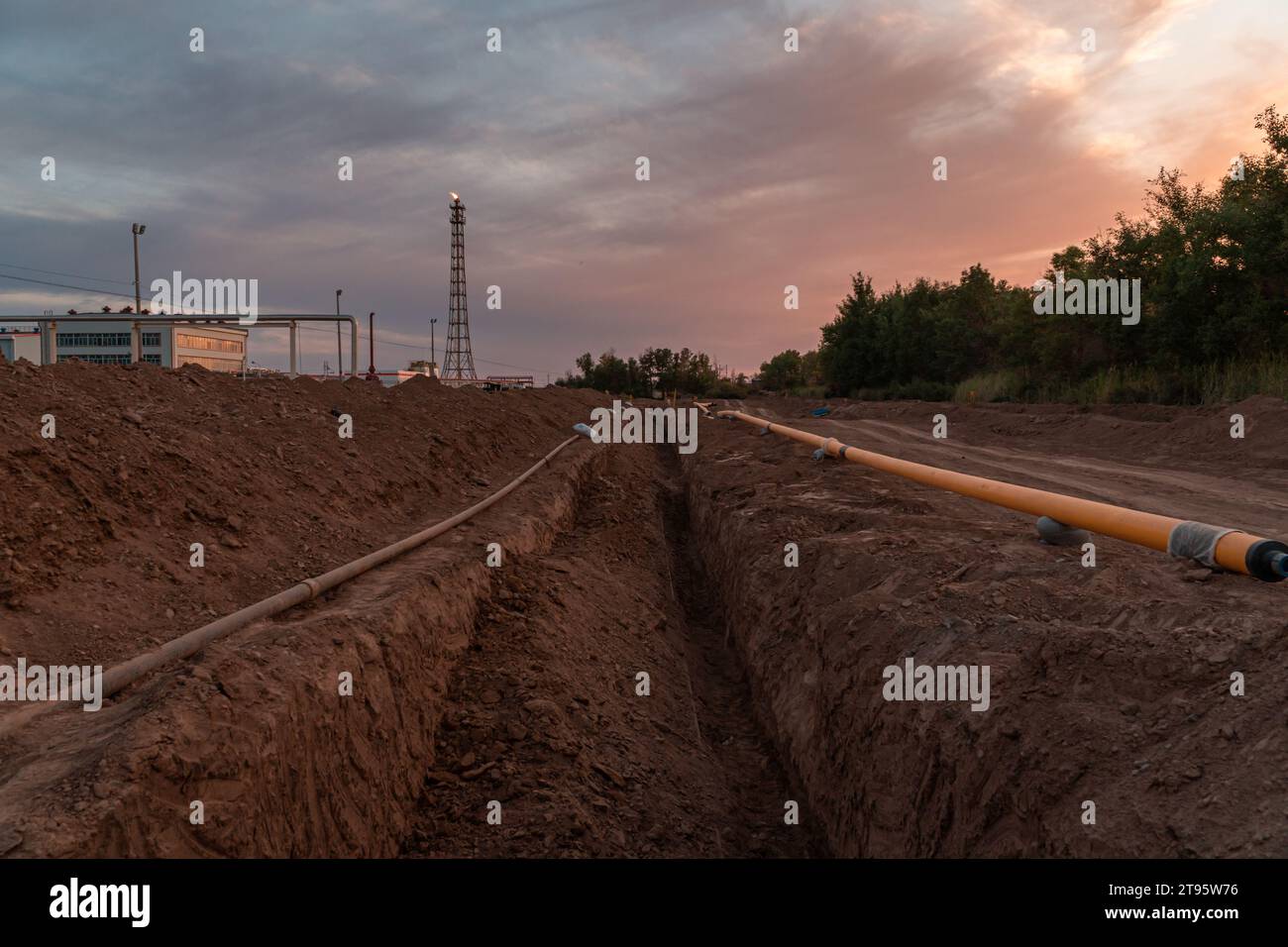 Oil and gas transportation pipelines under the sunset Stock Photo - Alamy