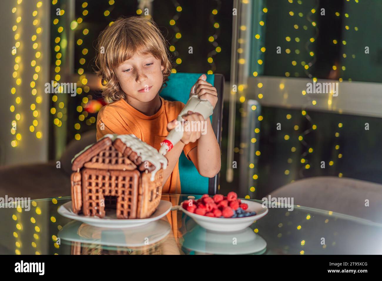 Immerse in festive delight as a boy crafts boy crafting an ...