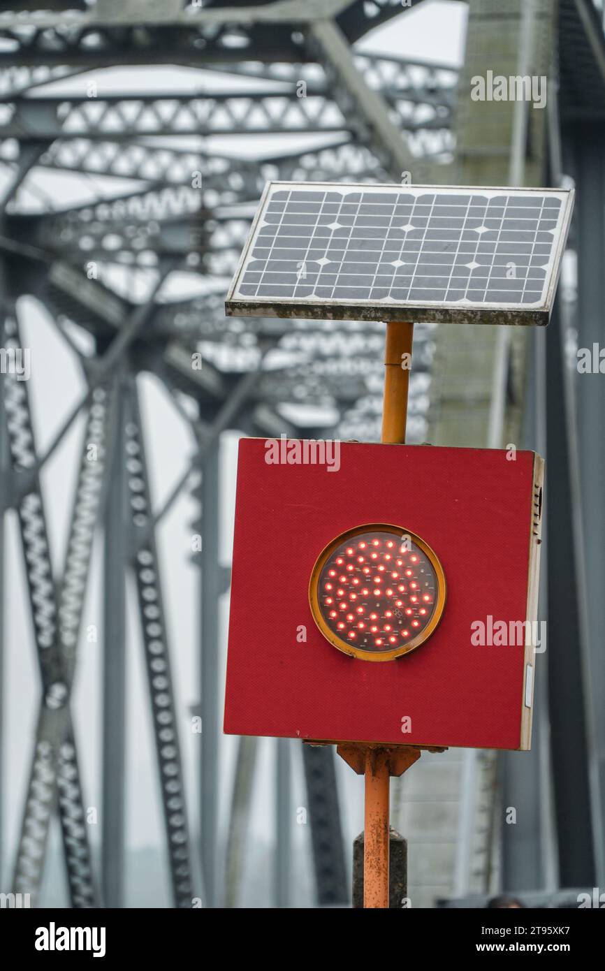 The red signal light on the iron bridge Stock Photo - Alamy