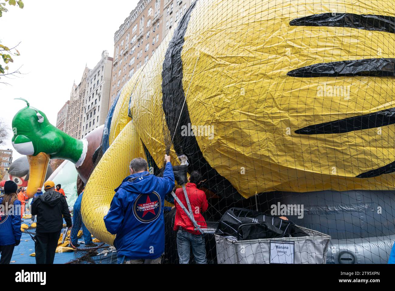 Members of the Macy's inflation team work on giant balloons as they ...