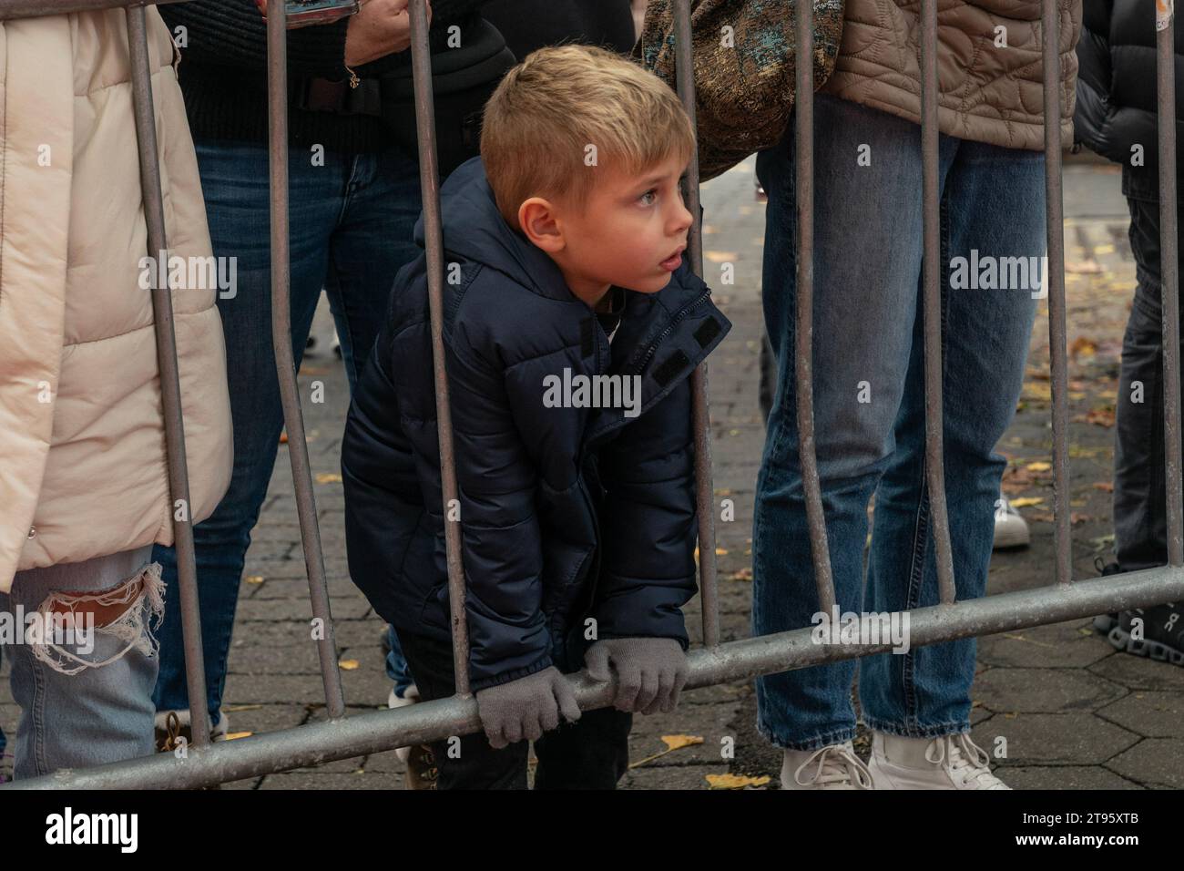A young kid looks as members of the Macy's inflation team work on giant ...
