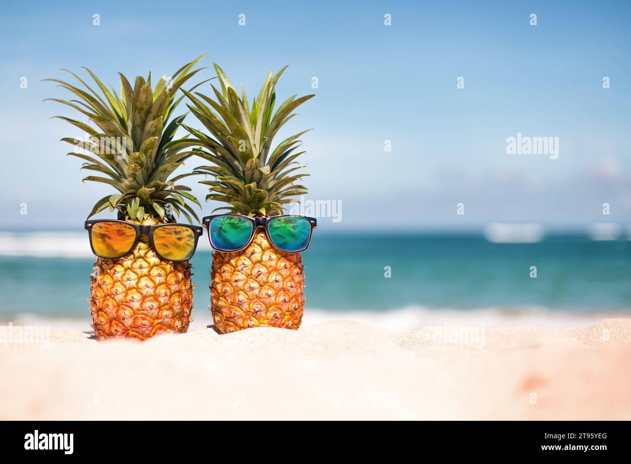 Two pineapples on beach tourism hi-res stock photography and images - Alamy