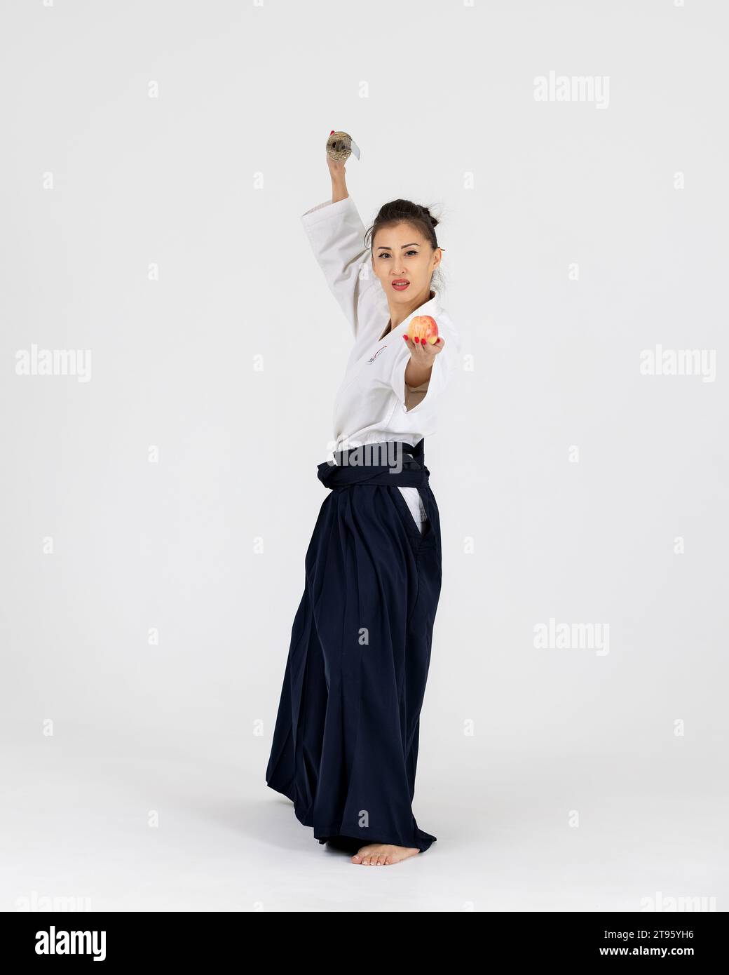 Aikido master woman in traditional samurai hakama kimono with black ...
