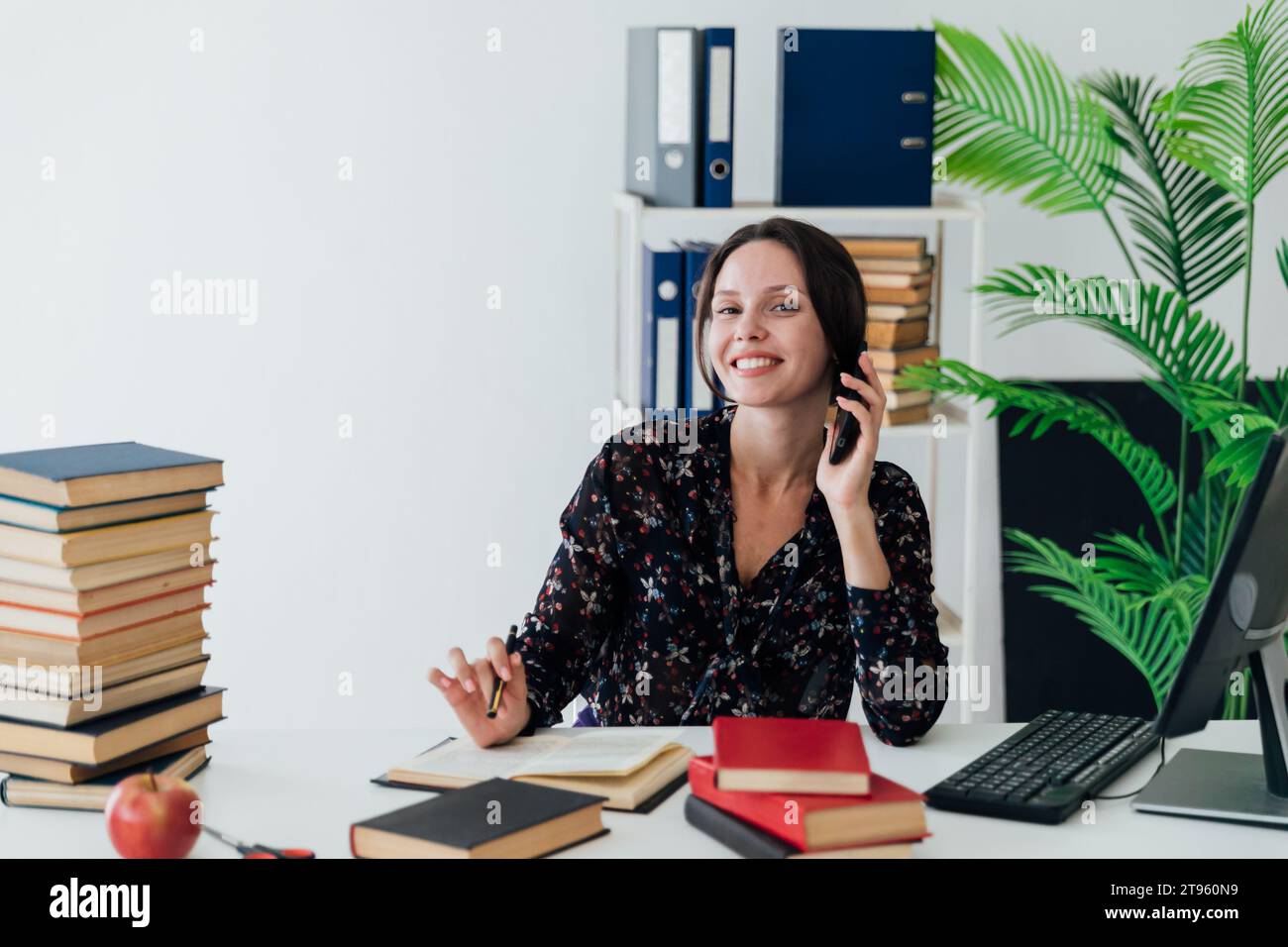 Beautiful business woman with phone in office in office business lady ...