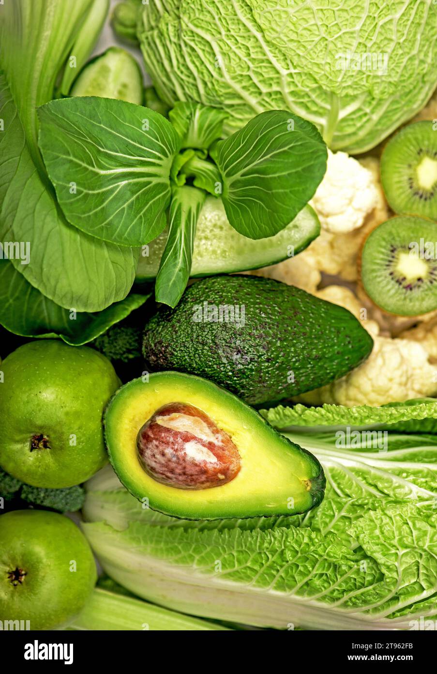 green still life. avocado, cabbage, apples, kiwi and other green ...