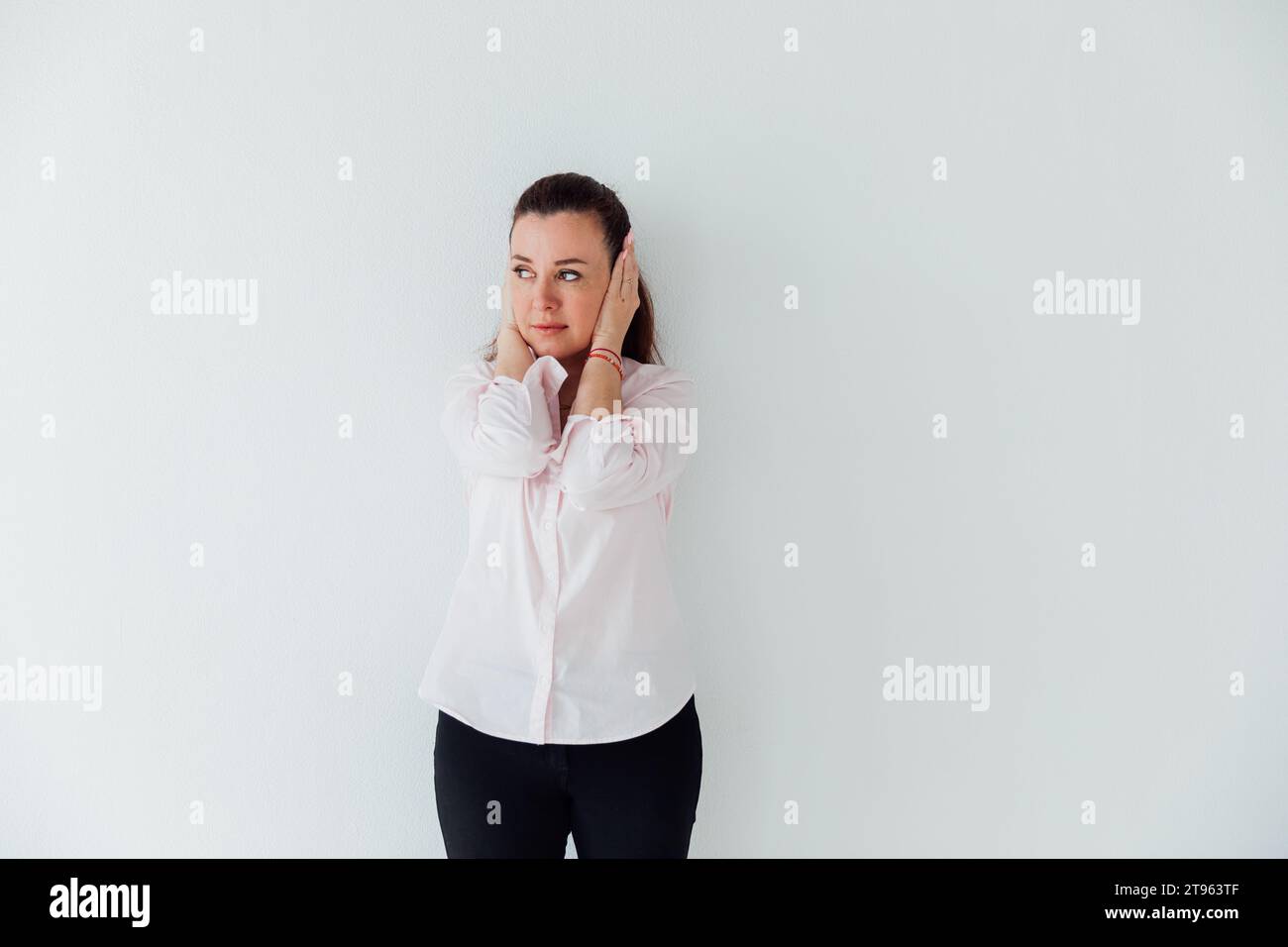 Woman covers ears hands fingers hi-res stock photography and images - Alamy