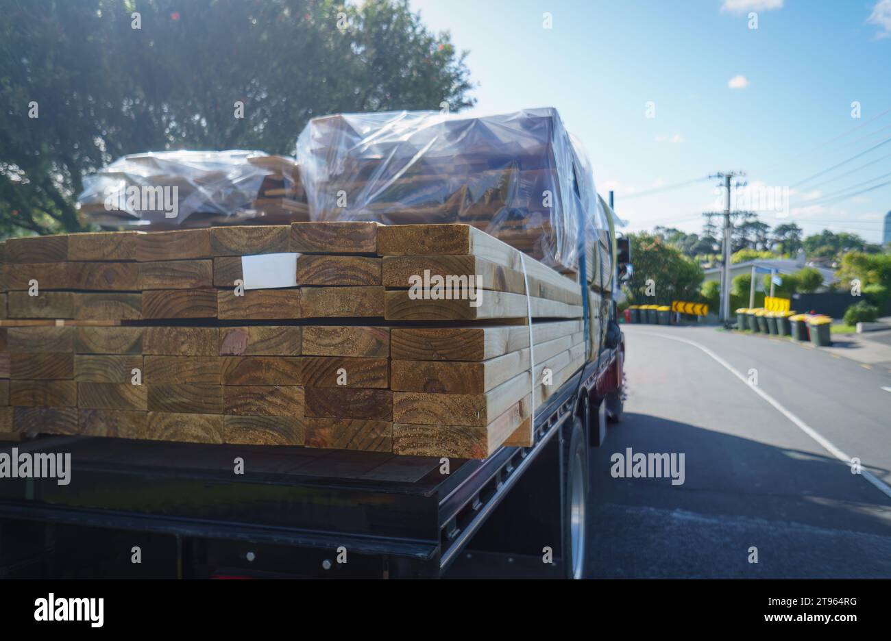A truck loaded with timber on the road in Auckland Stock Photo - Alamy