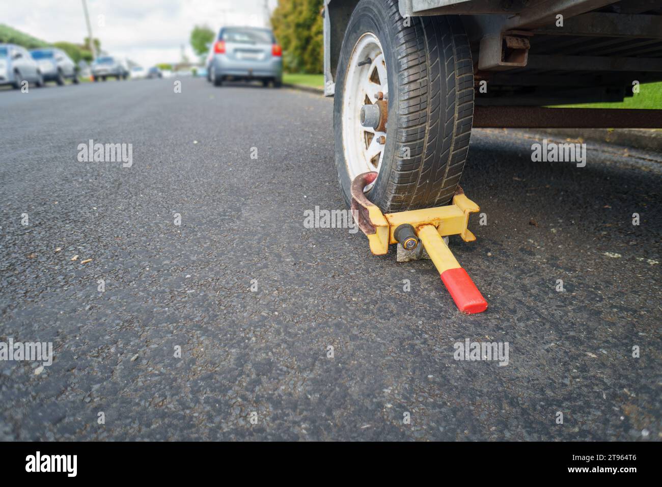 Wheel clamp anti-theft lock placed on a truck wheel Stock Photo - Alamy