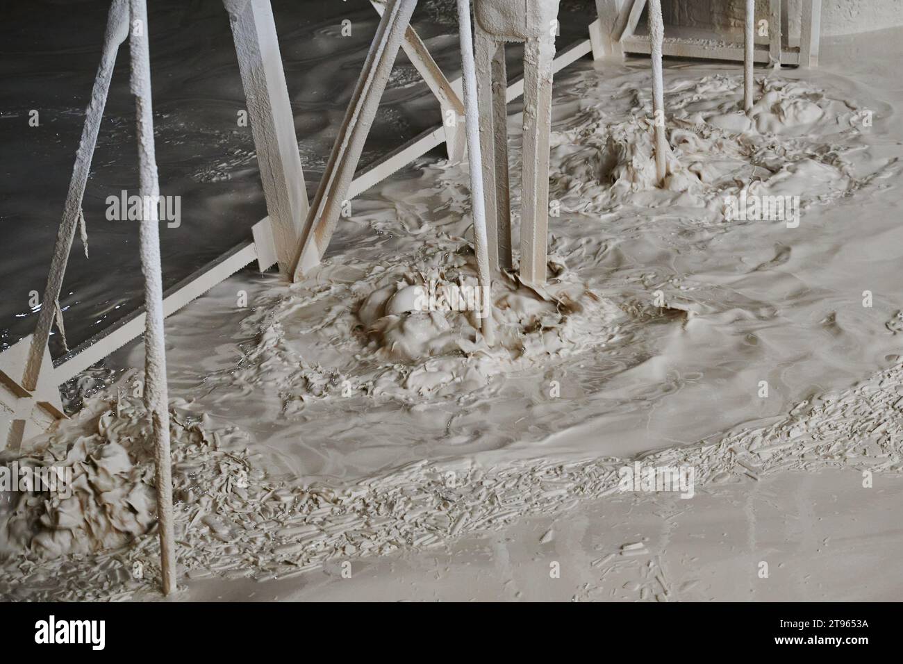 Blending liquid calcium carbonate with tools in reservoir Stock Photo ...