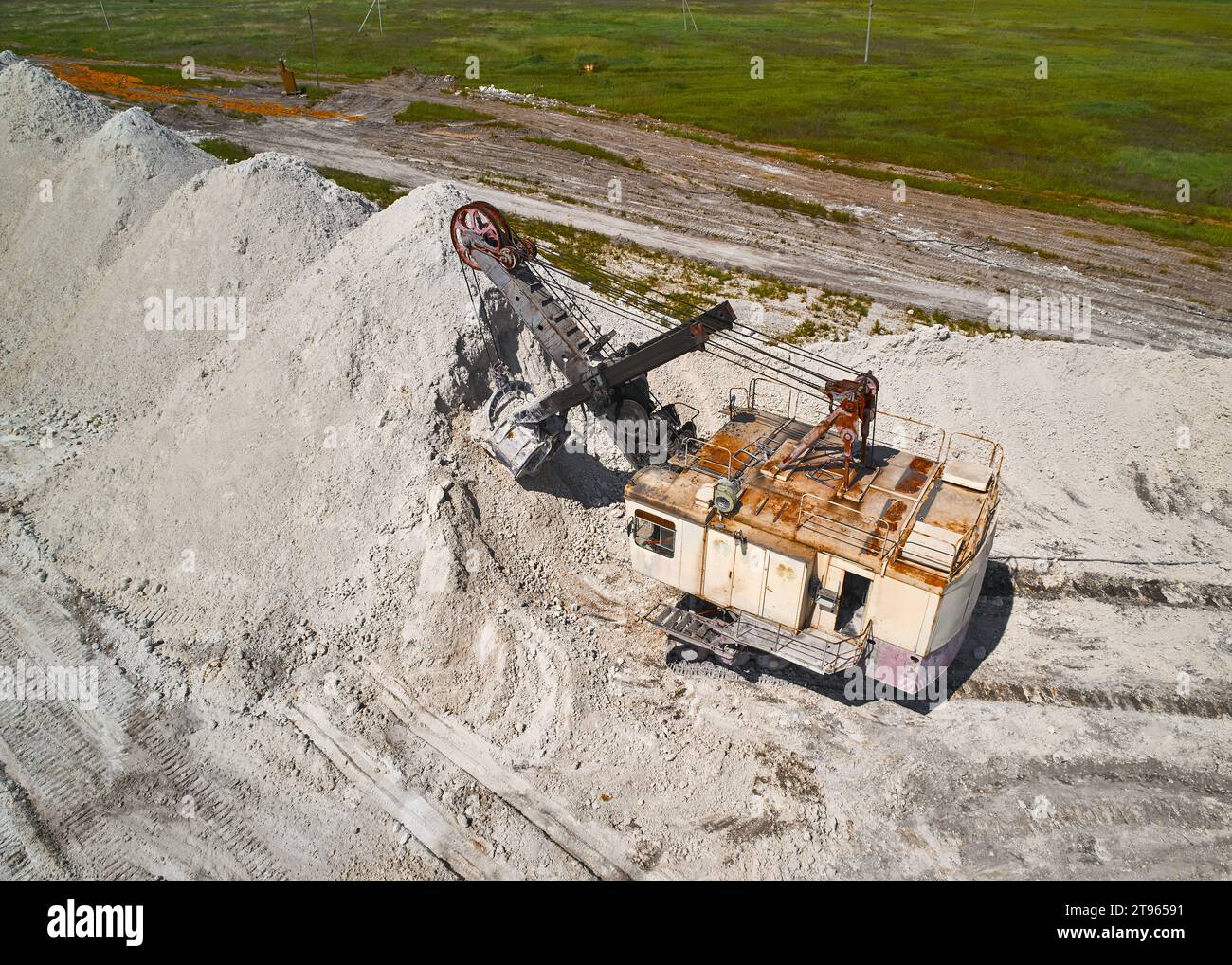 Tipper truck and Shovel mining excavator in mining quarry Stock Photo ...