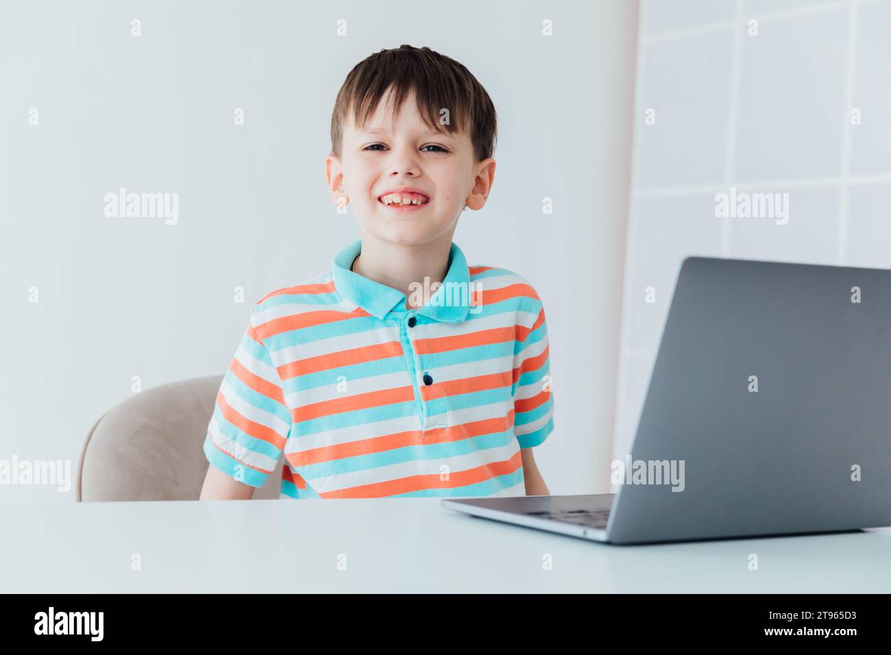 Boy doing learning task at school on computer Stock Photo - Alamy