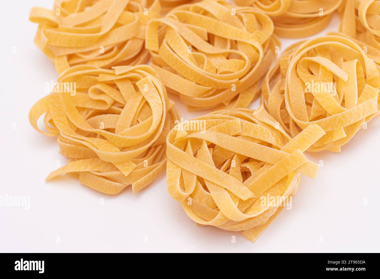 Scattered Classic Italian Raw Egg Fettuccine on White Table. Dry ...