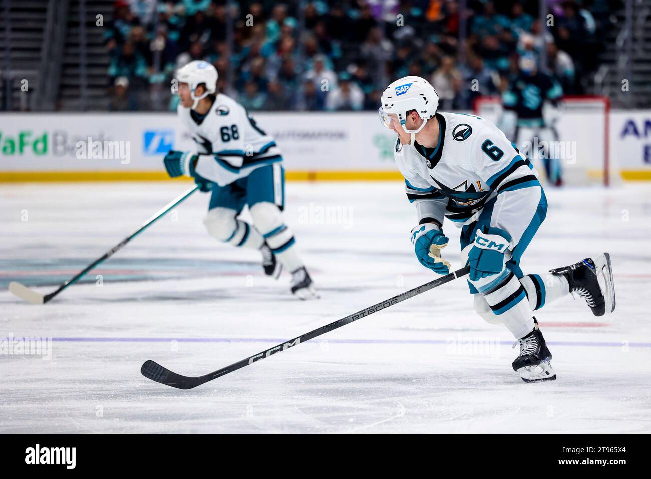 San Jose Sharks left wing Mike Hoffman (68) and defenseman Ty Emberson ...