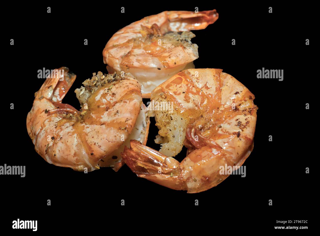 Three large, shell-fried king prawns, black tiger shrimps (Penaeus ...