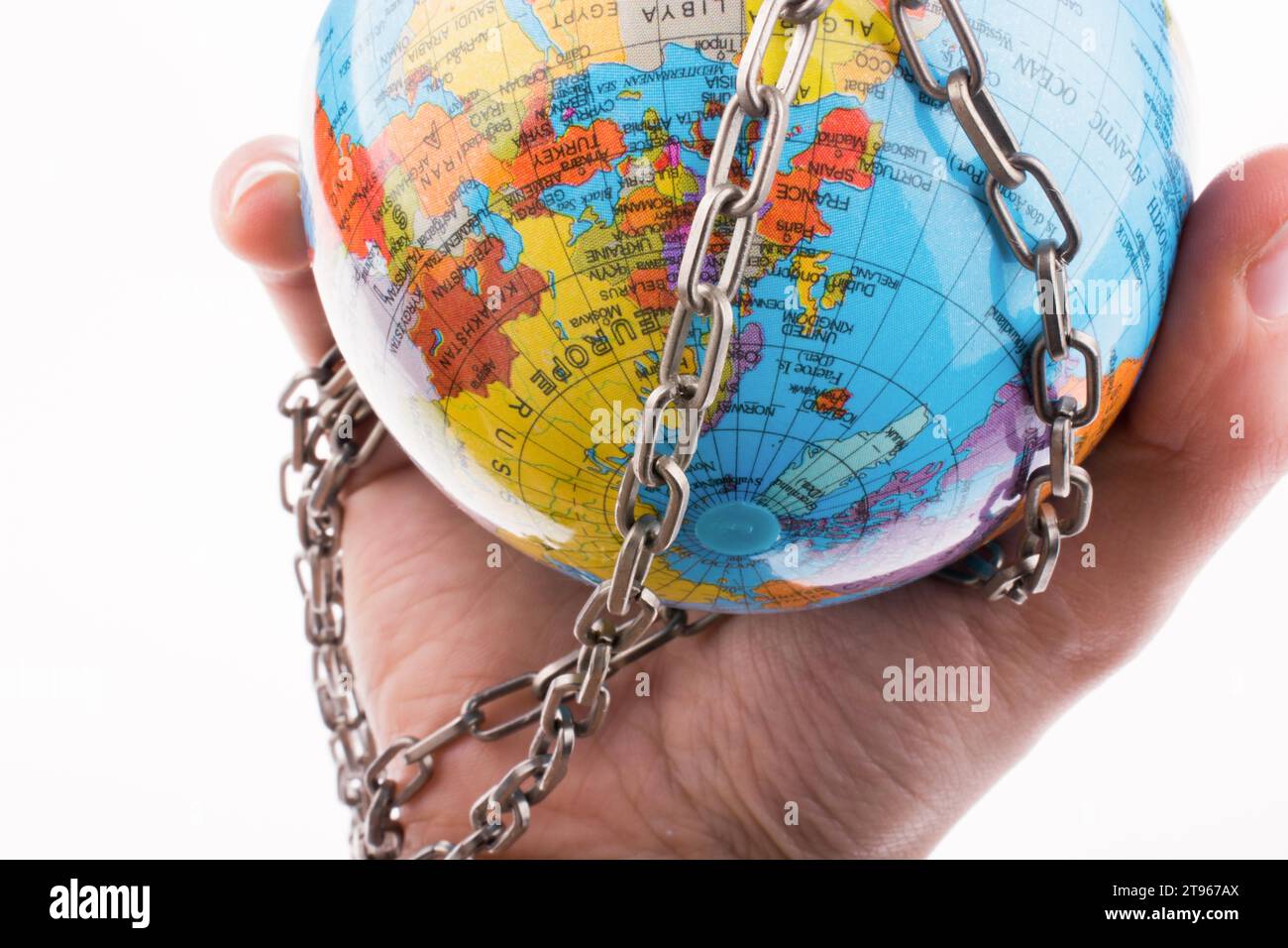 Globe in chain on a white background Stock Photo - Alamy