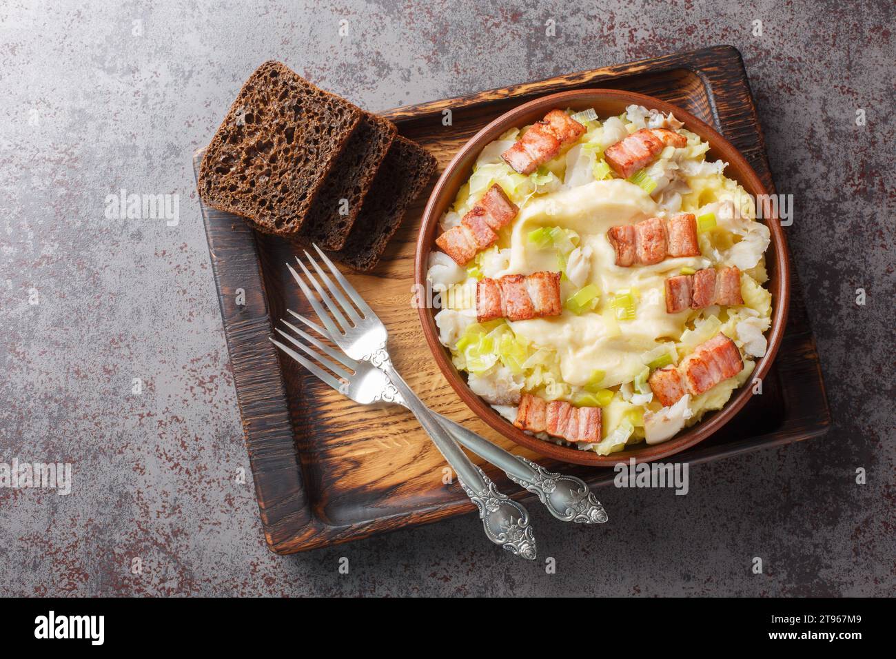 Norwegian Plukkfisk consists of potatoes, pieces of fish, and onions ...