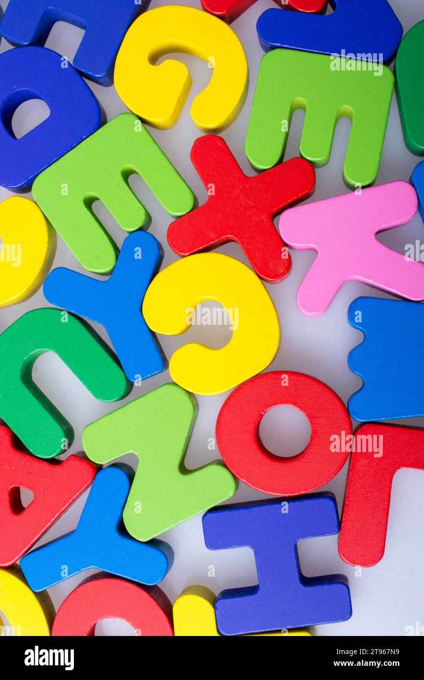 Colorful alphabet letter blocks scattered randomly on white background ...