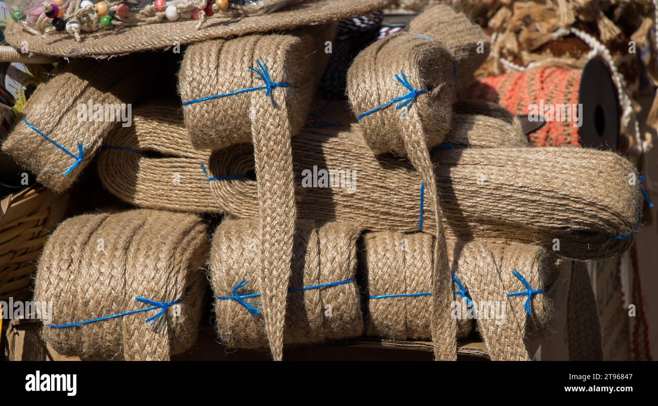 Plenty of spools or rolls of brown color linen string Stock Photo - Alamy