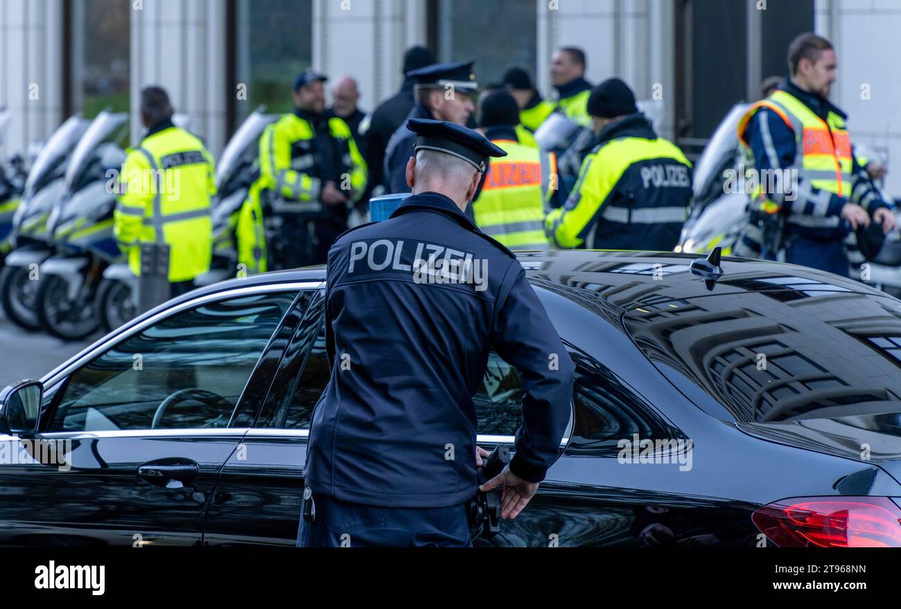 Police with yellow high-visibility waistcoats, waiting for the next ...