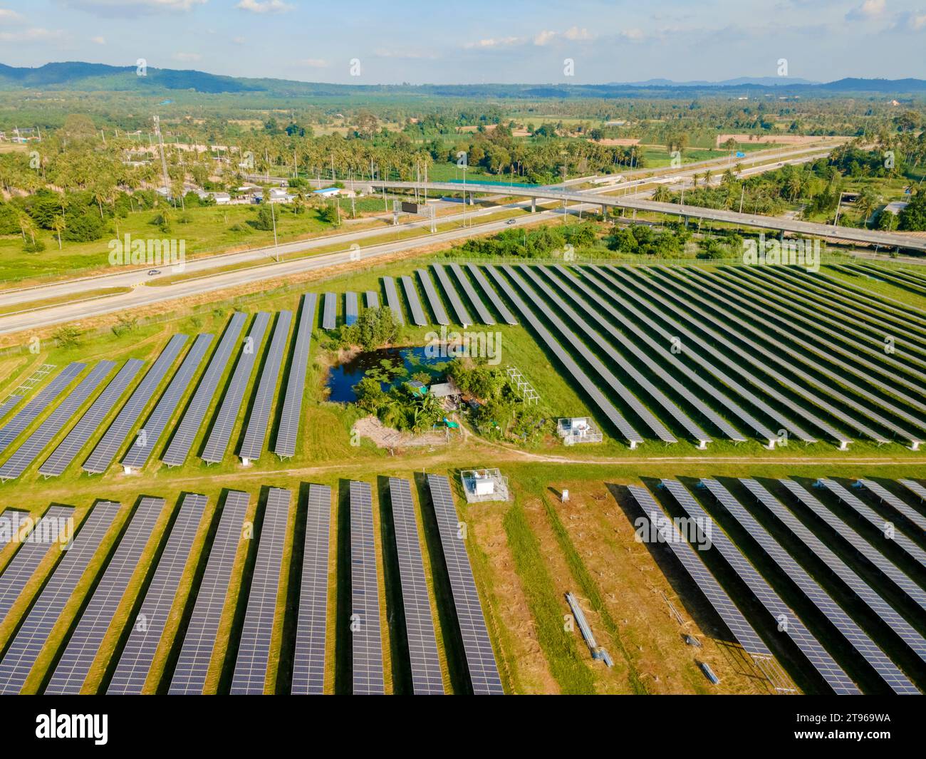 Sun power solar panel field alongside a highway road, Solar panels ...