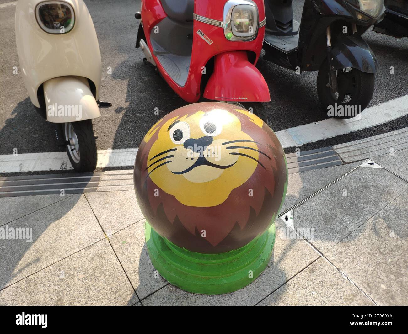Stone piers painted with funny cartoon faces attract passers-by's ...