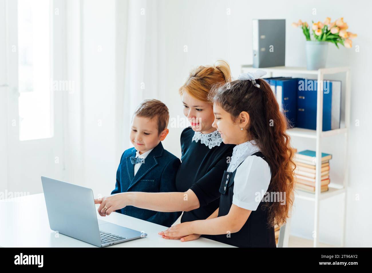 Mom teaching student on laptop at home hi-res stock photography and ...