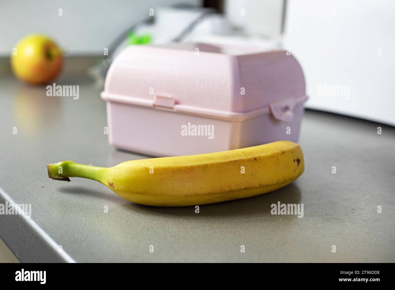 banana and a row of small containers with a snack. Back to school Stock ...