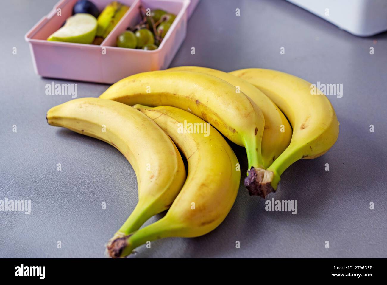 bunch of bananas and a row of small containers with snacks. Back to ...