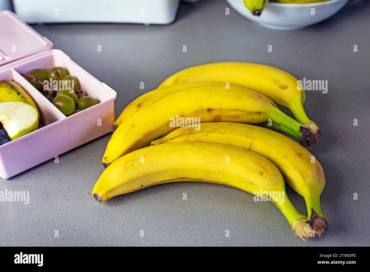 bunch of bananas and a row of small containers with snacks. Back to ...