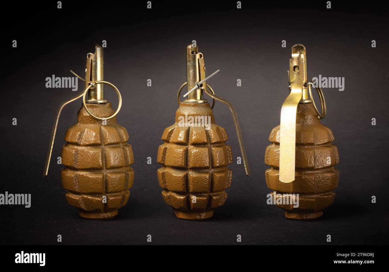 Several hand grenades on a dark background Stock Photo - Alamy