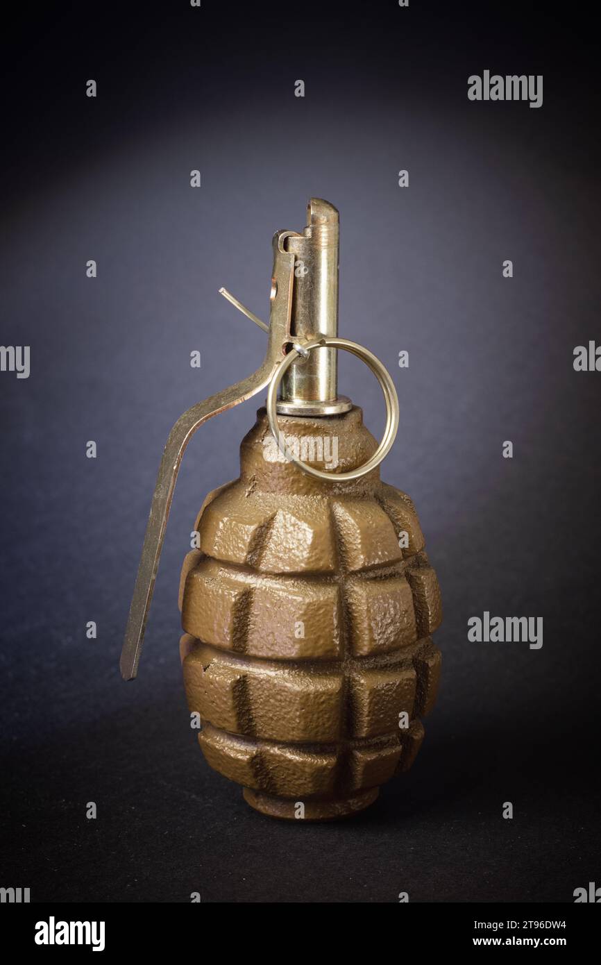 Hand grenade on a dark background Stock Photo - Alamy