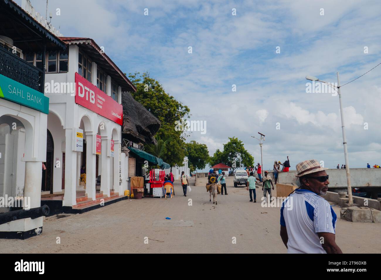 Scenic view of Kenyatta Road, the main street in Lamu with people and ...