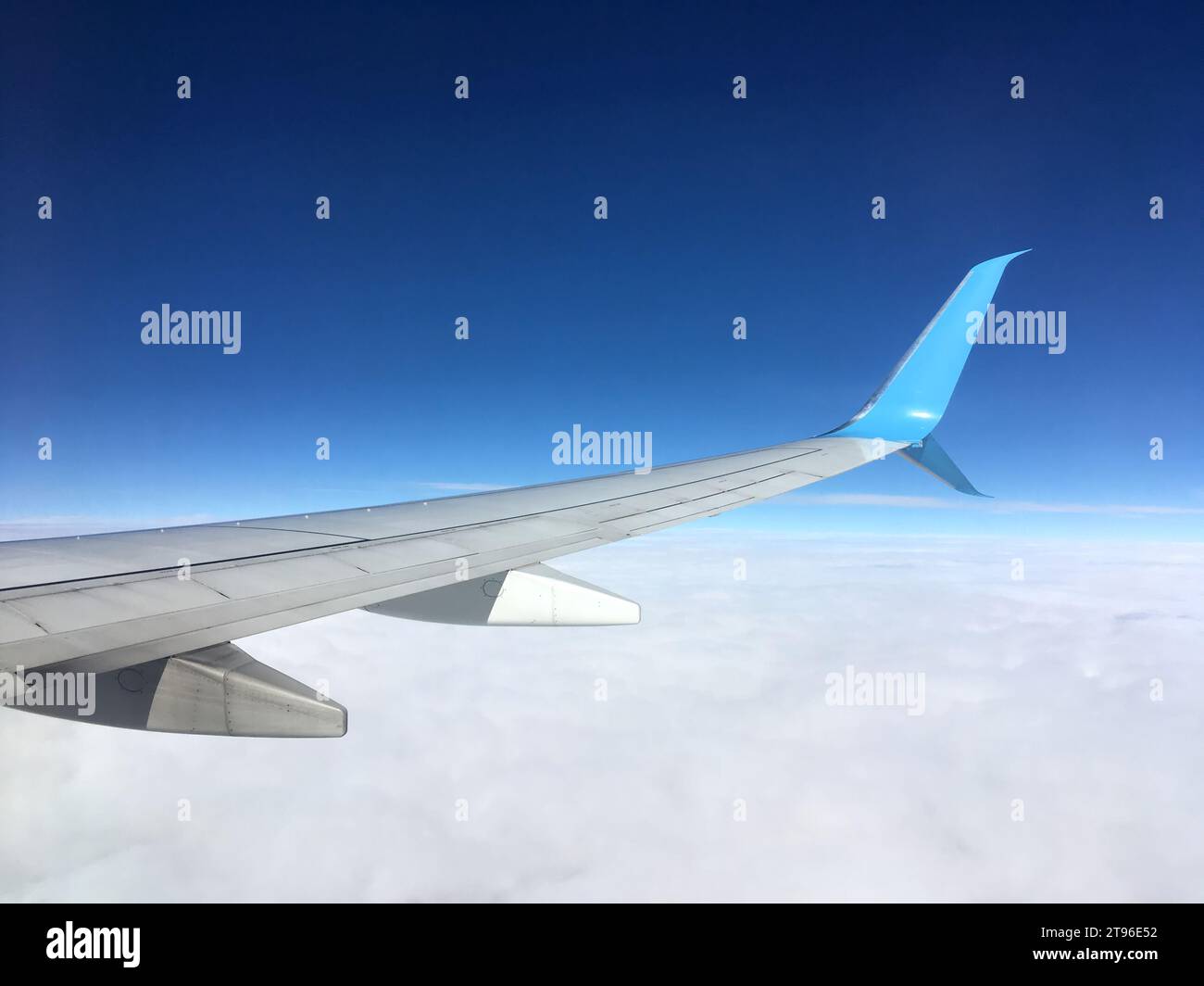 Passenger supersonic plane wing view from the moving airplane high in ...