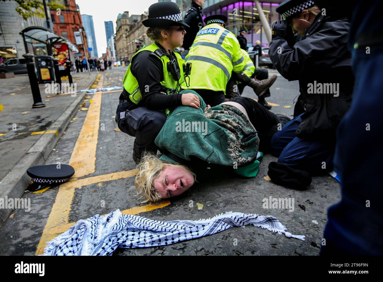 A Palestine Action activist is wrestled to the ground by police ...