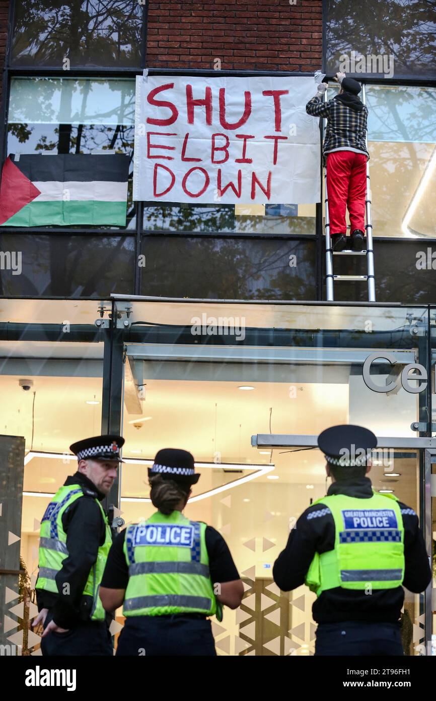 A Palestine Action activist occupies the glass roof and attaches a ...