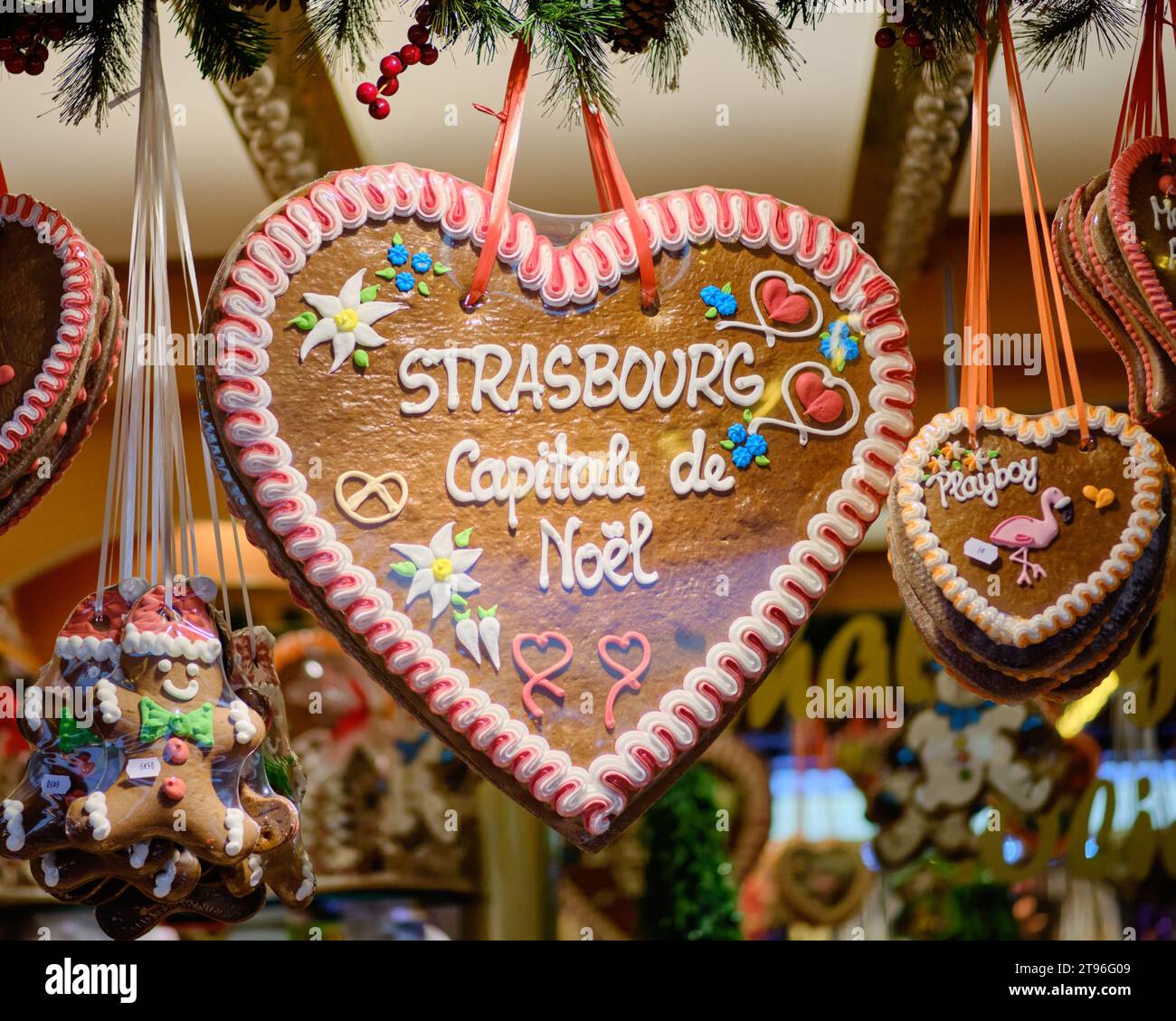 Gingerbread cookies in shape of hearts hanging from stall with messages ...