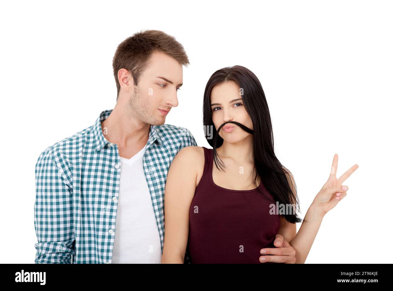 Playful couple fooling on valentine day. Beautiful young loving couple bonding to each other and ...