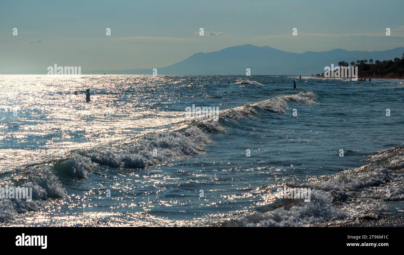 Waves crashing on the beach of Marbella at sunset Stock Photo - Alamy