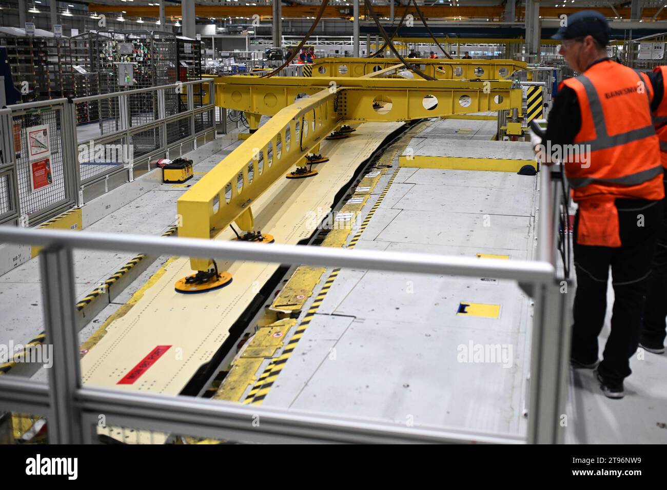 Workers on the Airbus A350 wing manufacturing floor at the Airbus North ...