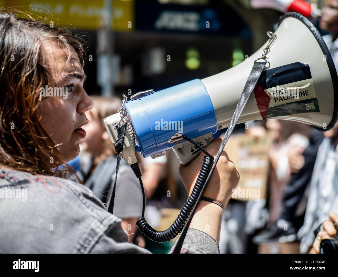 A student demonstrator seen with a megaphone bearing a 'Free Palestine ...