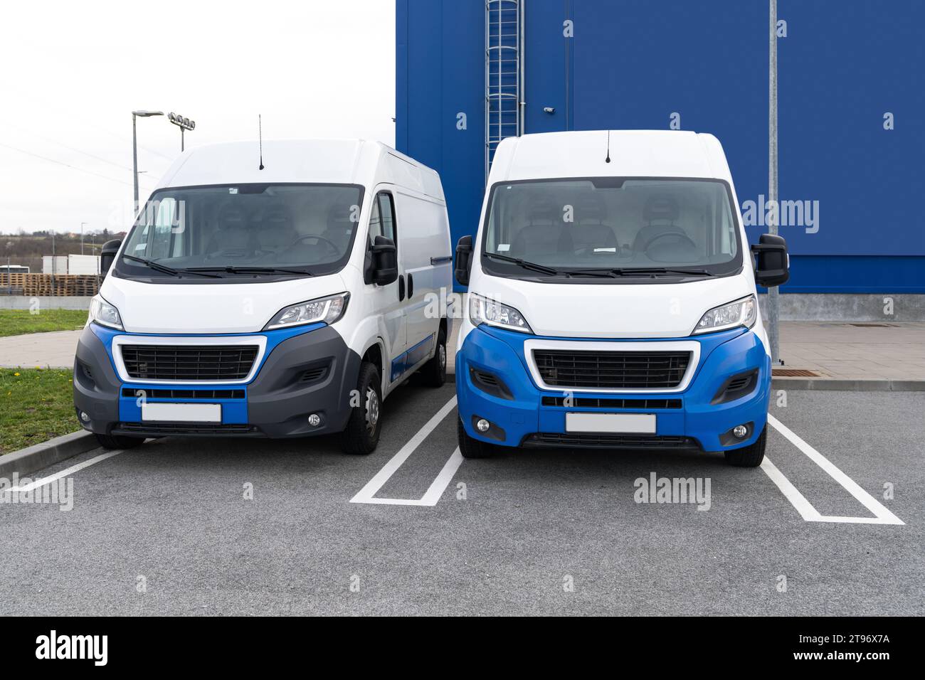 Delivery vans in a rows. Commercial fleet Stock Photo - Alamy
