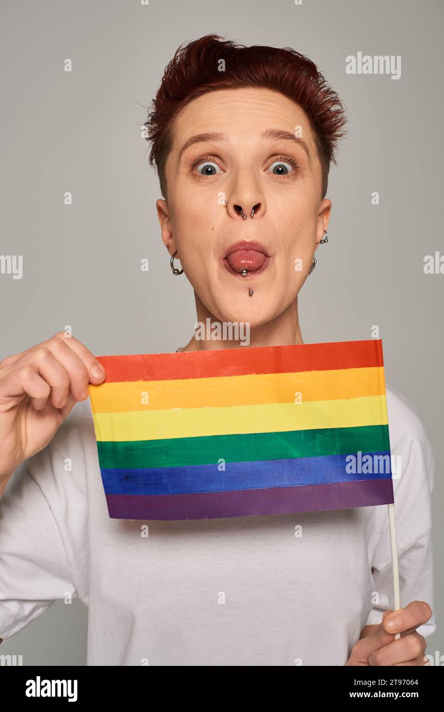 redhead queer model with piercing and small LGBT flat sticking out and ...