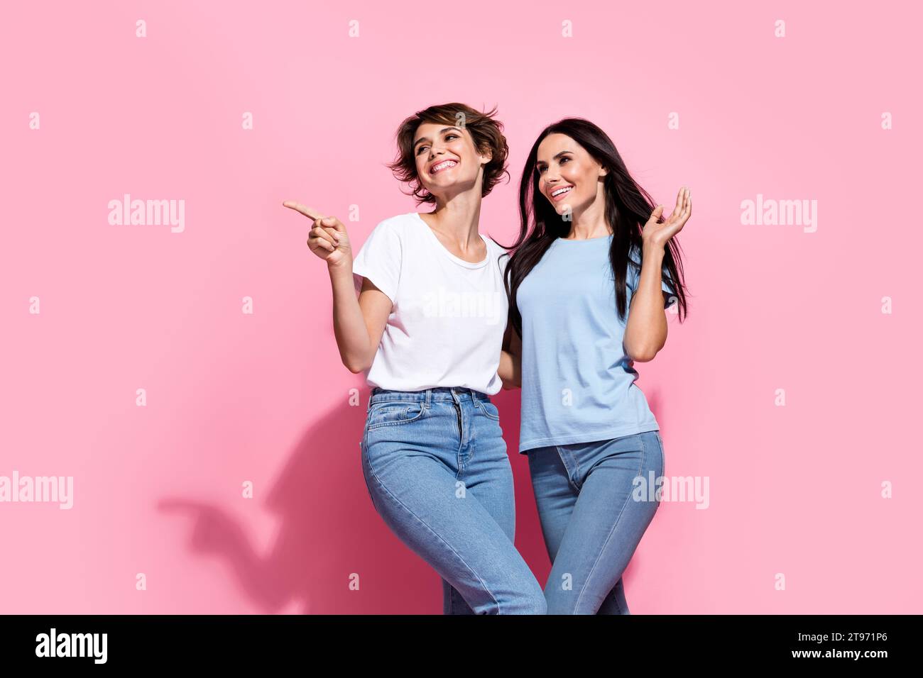 Photo of two fancy charming girls lesbians together party point finger ...